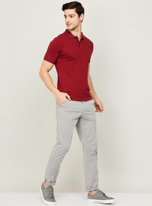 Buy CODE Solid Regular Fit Polo T-shirt from CODE at just INR 999.0