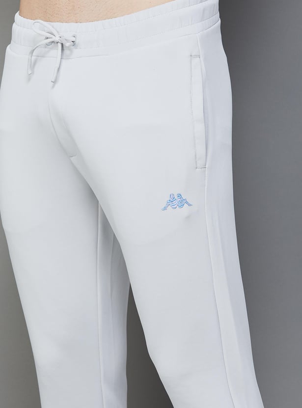 Buy KAPPA Men Solid Elasticated Track Pants from Kappa at just INR 1499.0