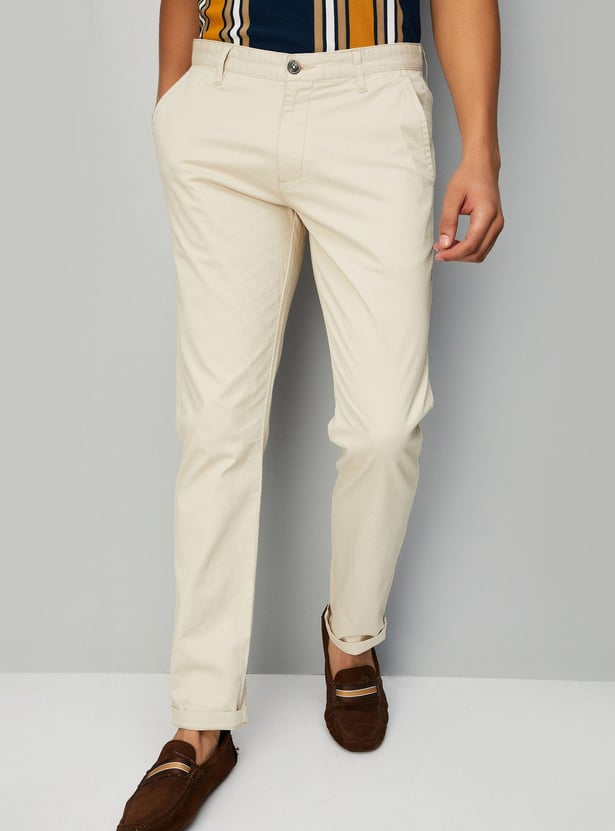 Buy Men Solid Slim Fit Stretch Chinos Online at just Rs. 899.0 ...