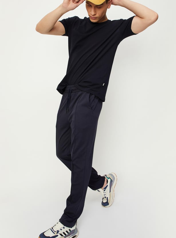 Buy Men Solid Athleisure Track Pants Online at just Rs. 999.0 ...