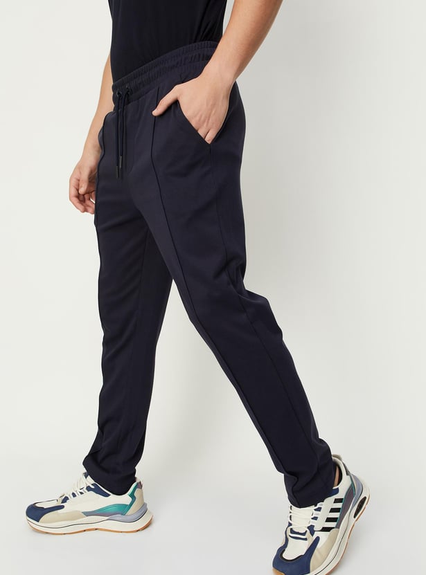 Buy Men Solid Athleisure Track Pants Online at just Rs. 999.0 ...